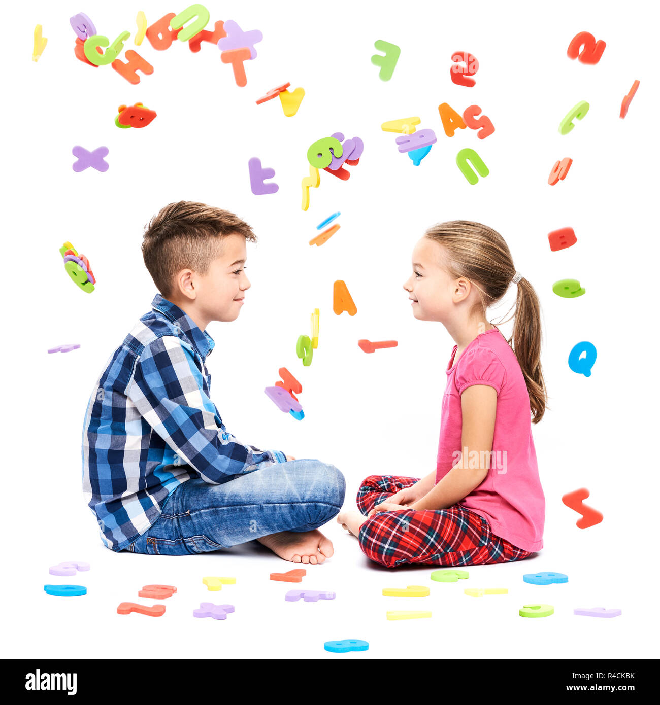 Cute children with large colorful alphabet letters on white background ...