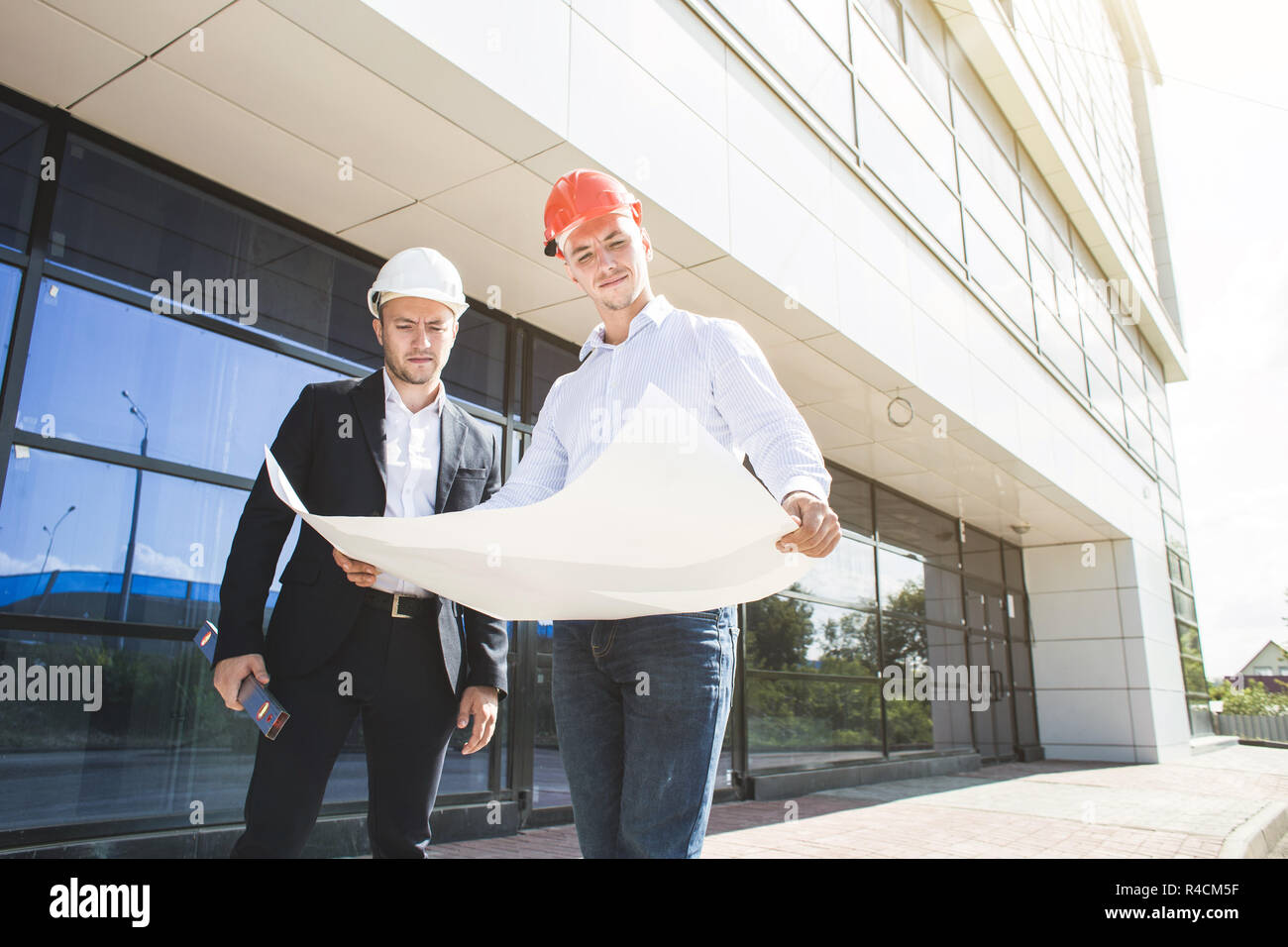 Man checking blueprint on desk hi-res stock photography and images - Alamy