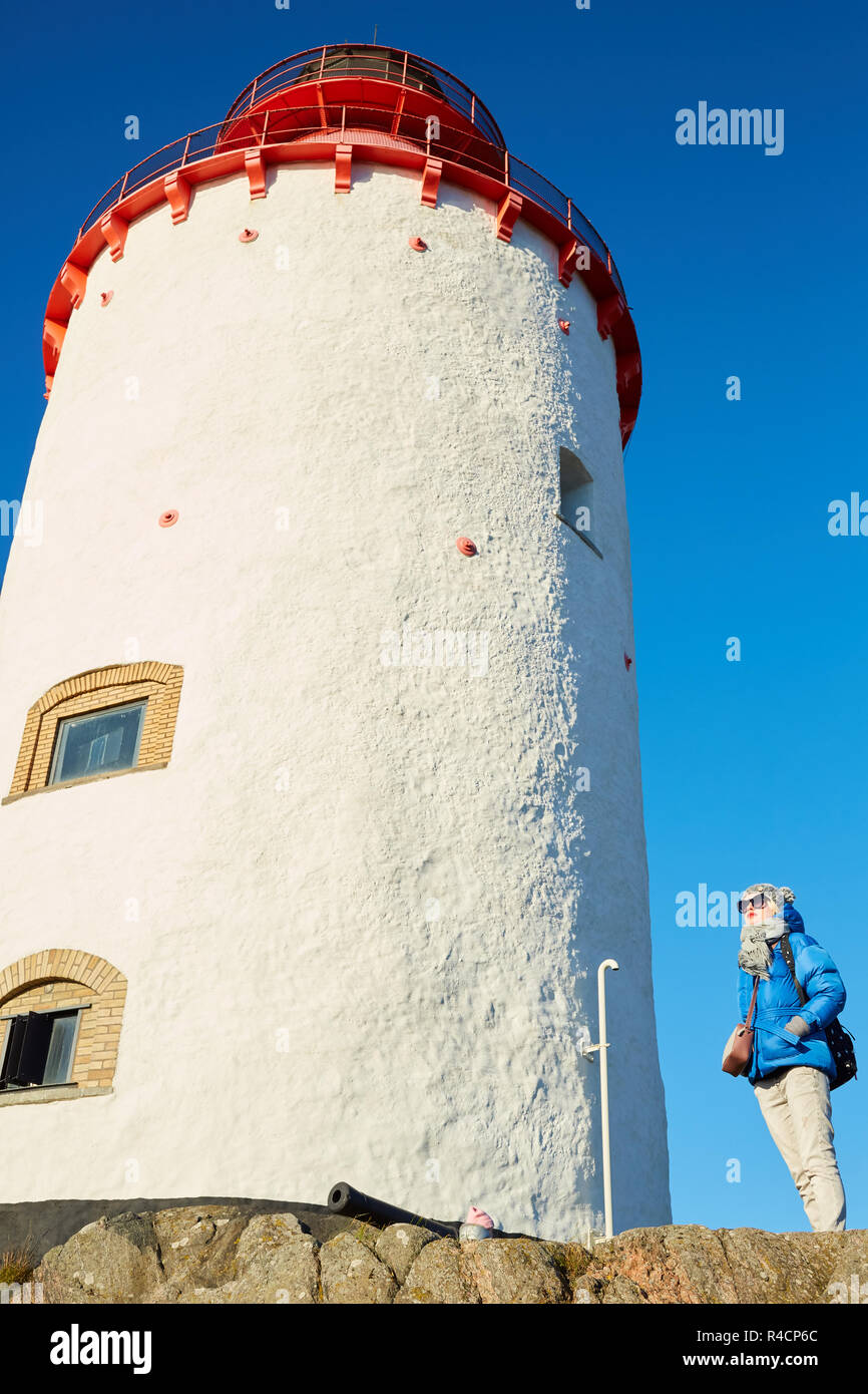 Beautiful woman posing near lighthouse. Travel the world concept Stock ...