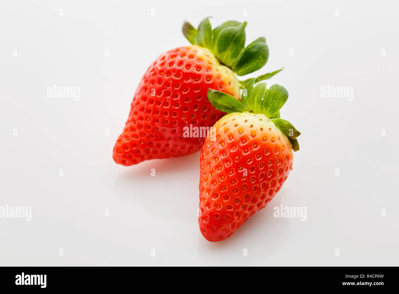 Closeup of not fully ripe strawberries Stock Photo - Alamy