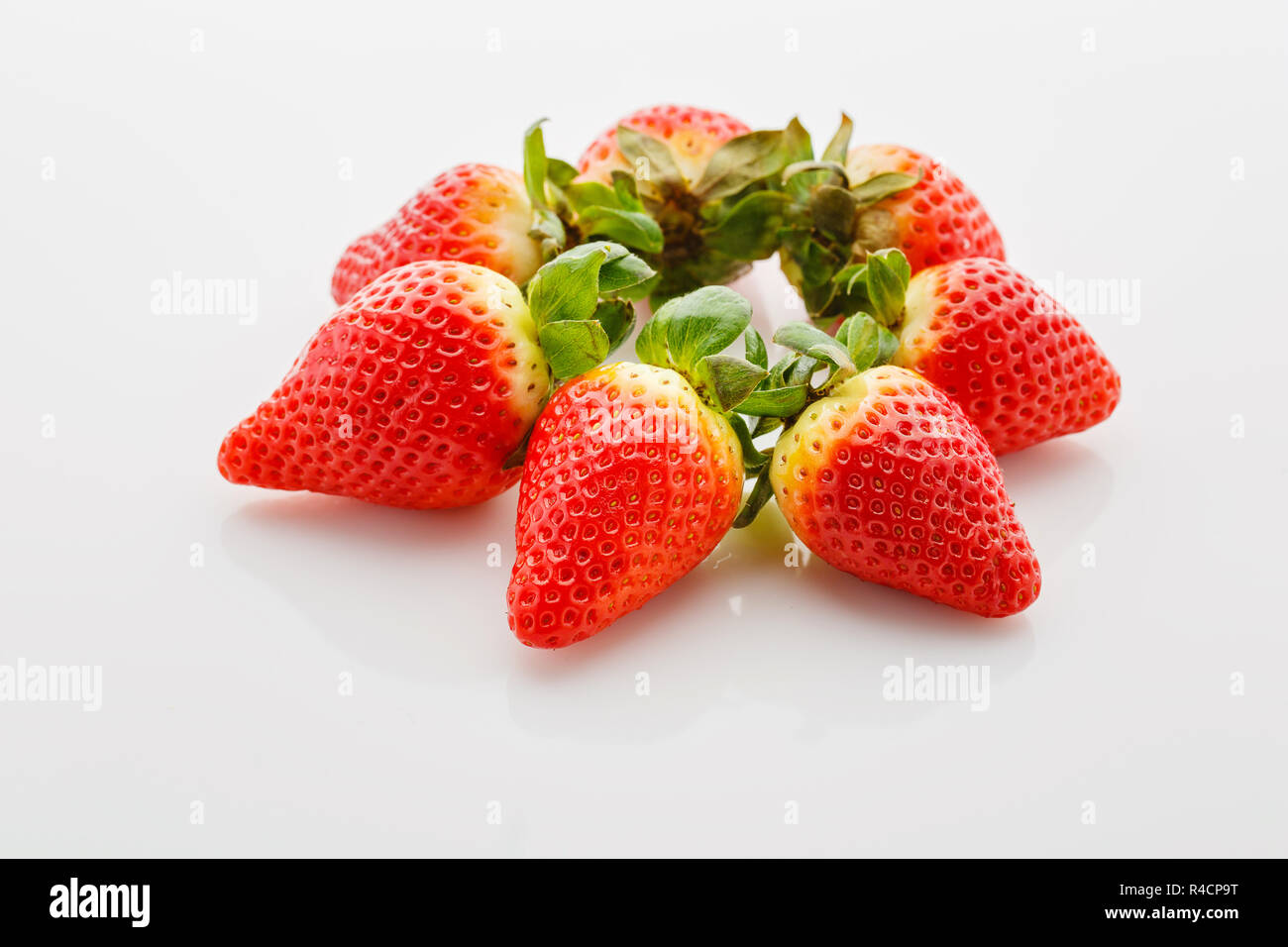 Closeup of not fully ripe strawberries Stock Photo - Alamy