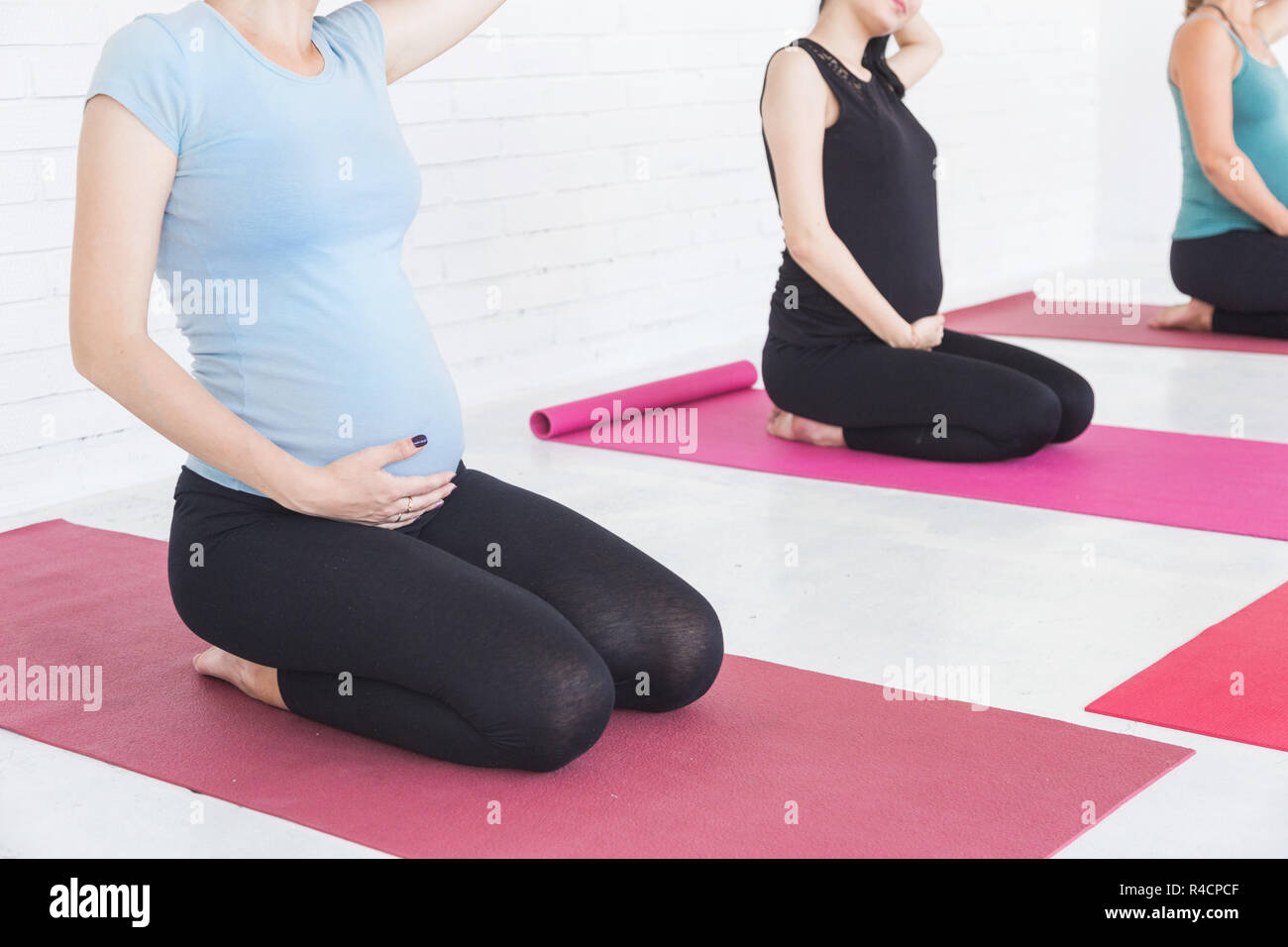 pregnancy, sport, fitness, people and healthy lifestyle concept - group ...