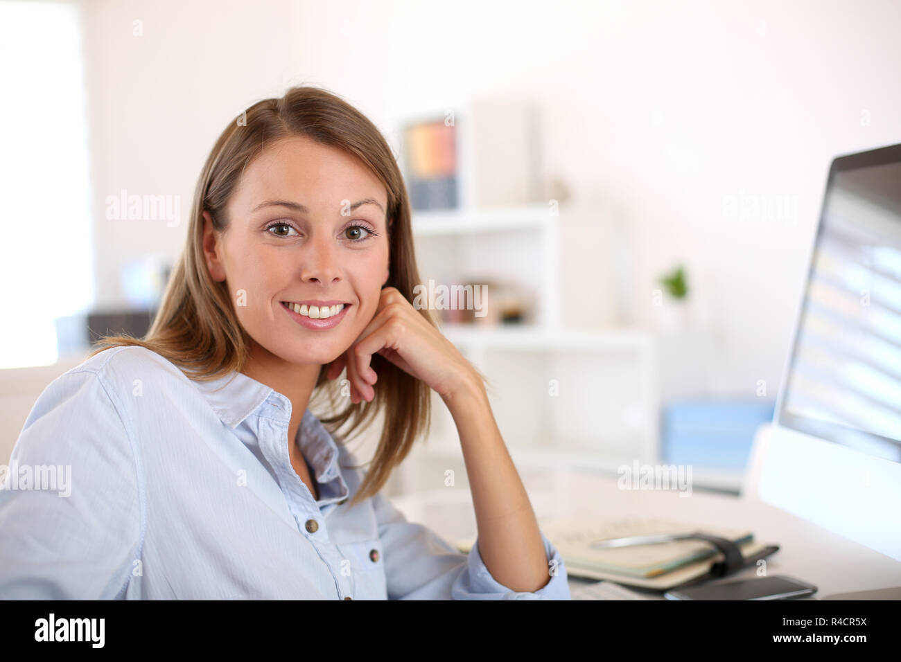 Portrait of beautiful office-worker Stock Photo - Alamy