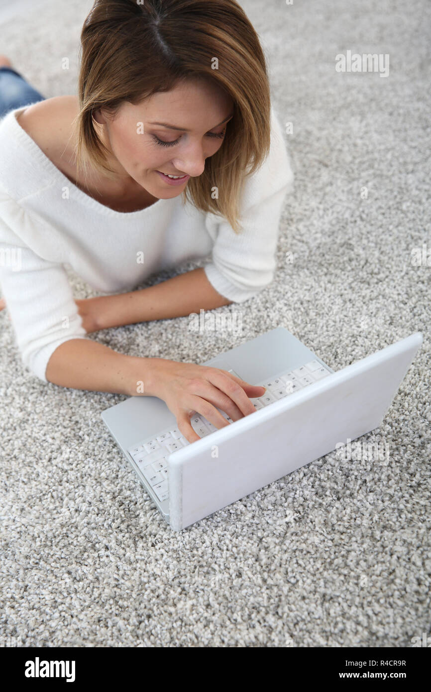 Girl laptop laying on floor hi-res stock photography and images - Alamy