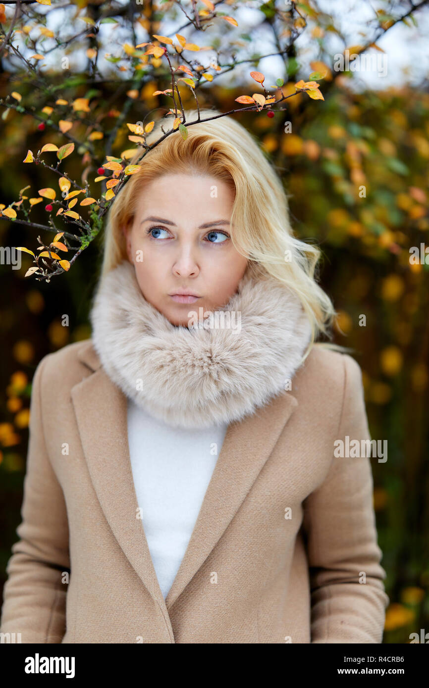 Woman walking outdoors thinking Stock Photo - Alamy