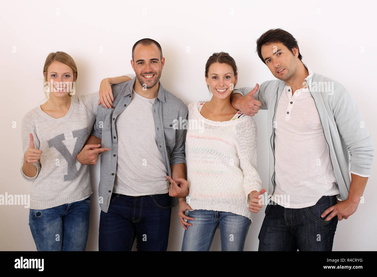 Group of smiling friends hanging around Stock Photo - Alamy
