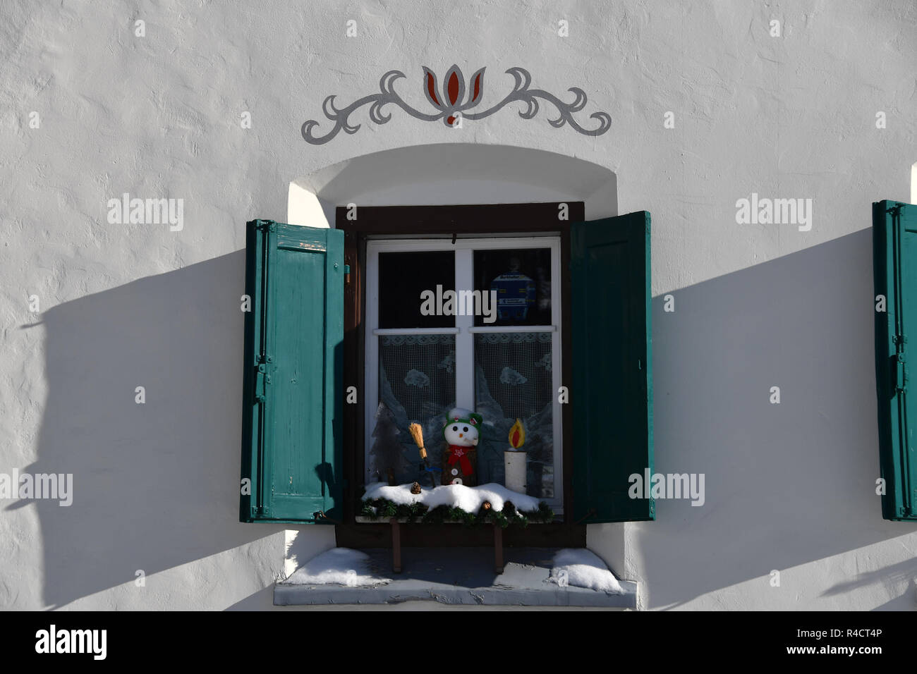 christmas decoration on mountain hut window detail Stock Photo - Alamy