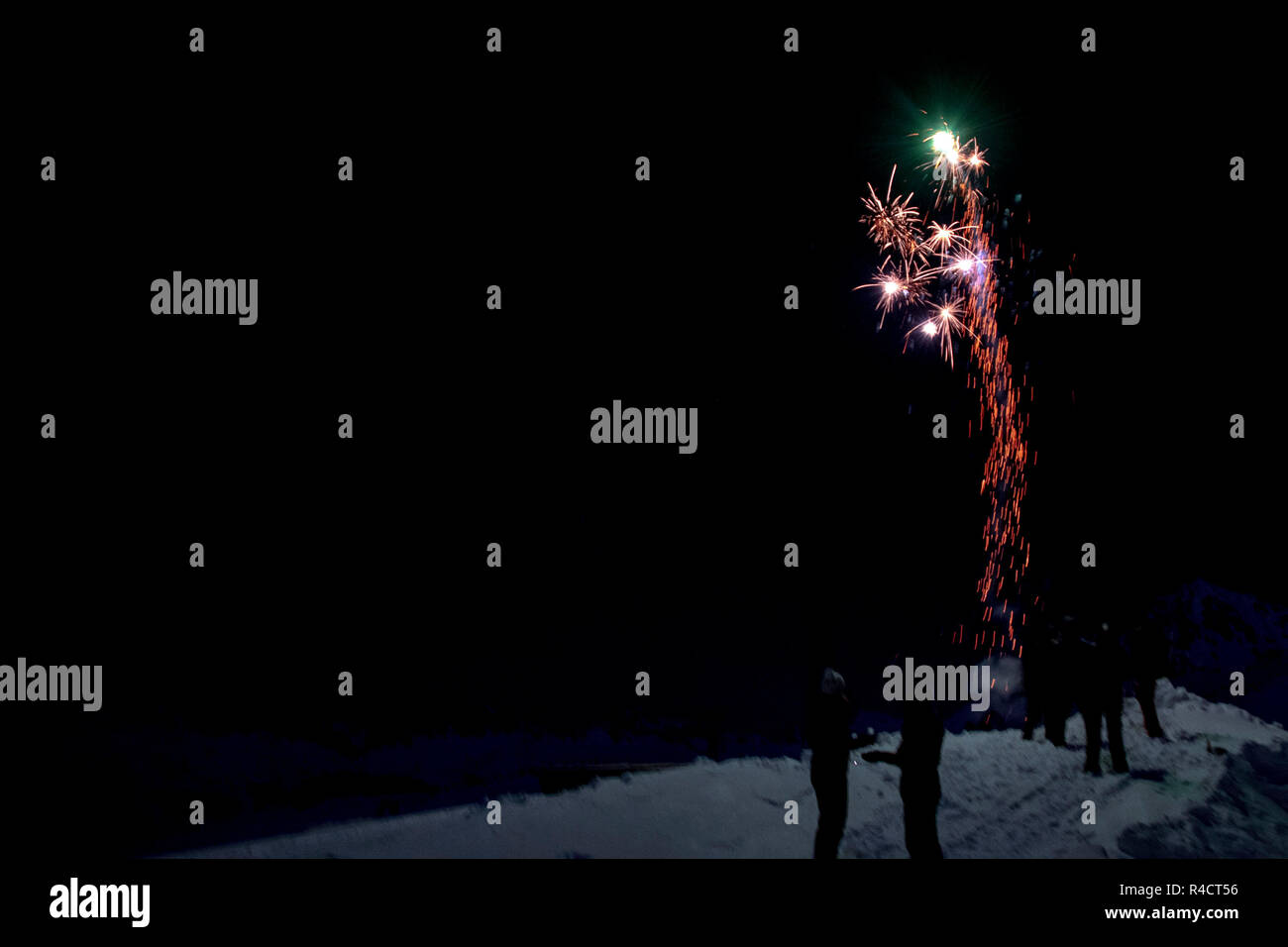 Happy new year eve fireworks on winter snow mountain background Stock ...