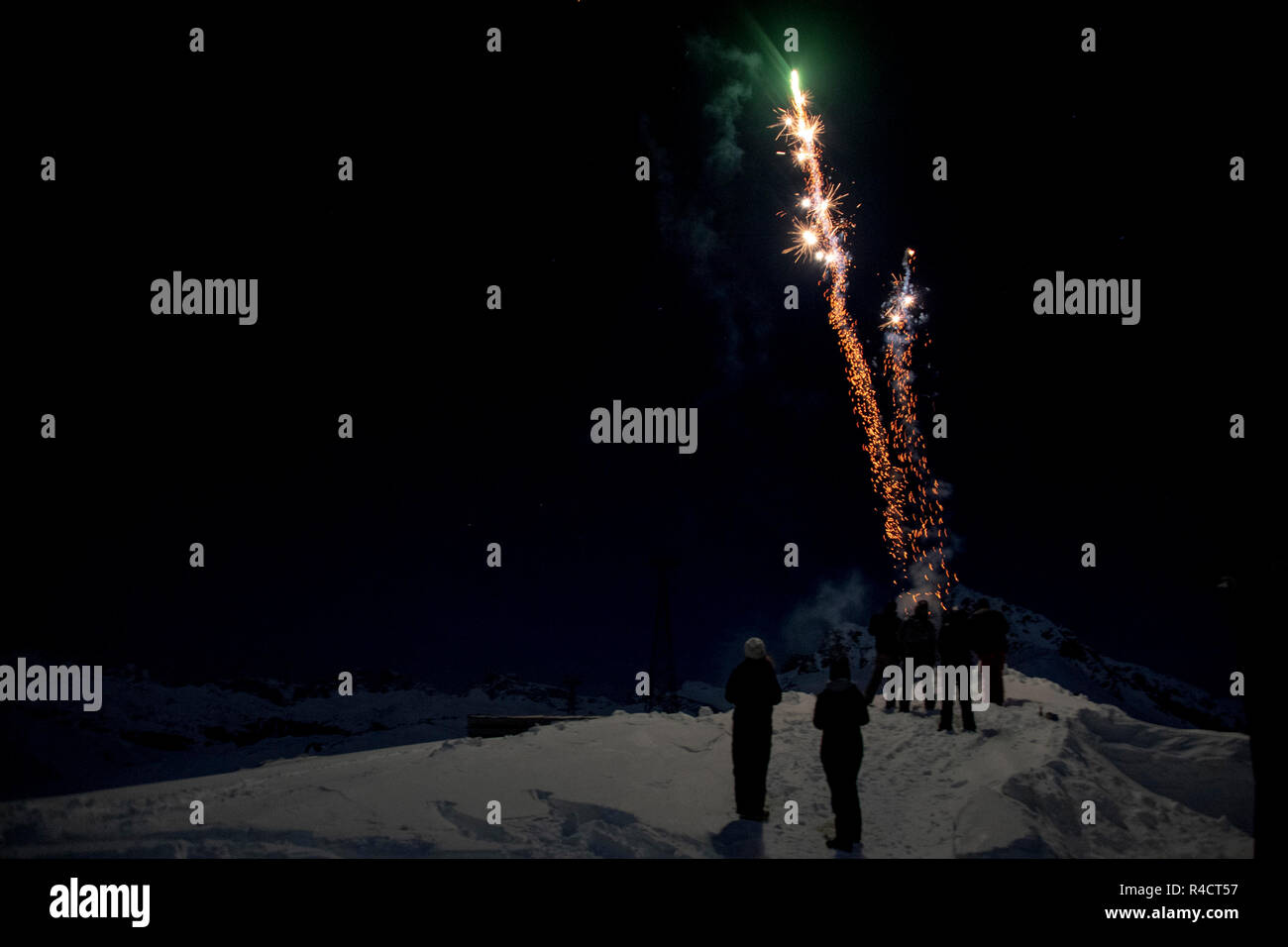Happy new year eve fireworks on winter snow mountain background Stock ...