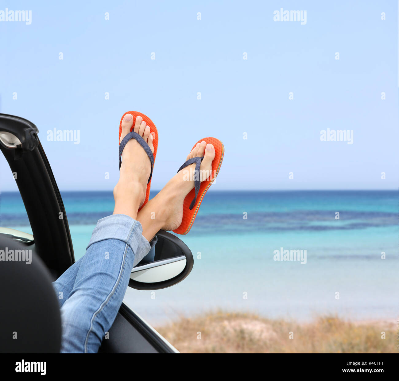 Closeup of woman's feet by convertible car window Stock Photo - Alamy