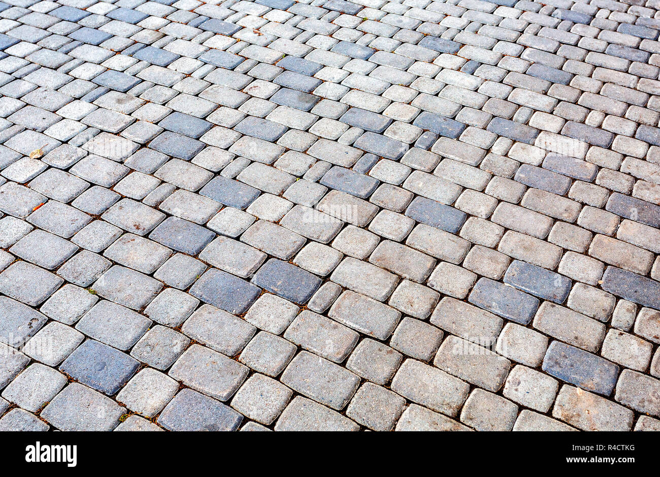 Grey paving stones as background texture closeup Stock Photo - Alamy