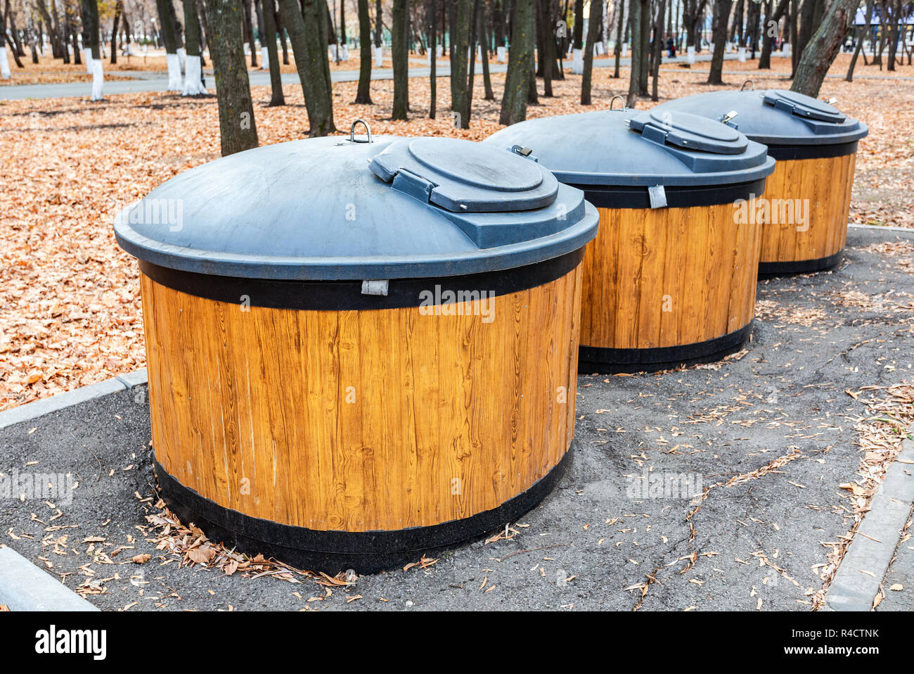Garbage plastic containers for waste and trash at the autumn park Stock ...