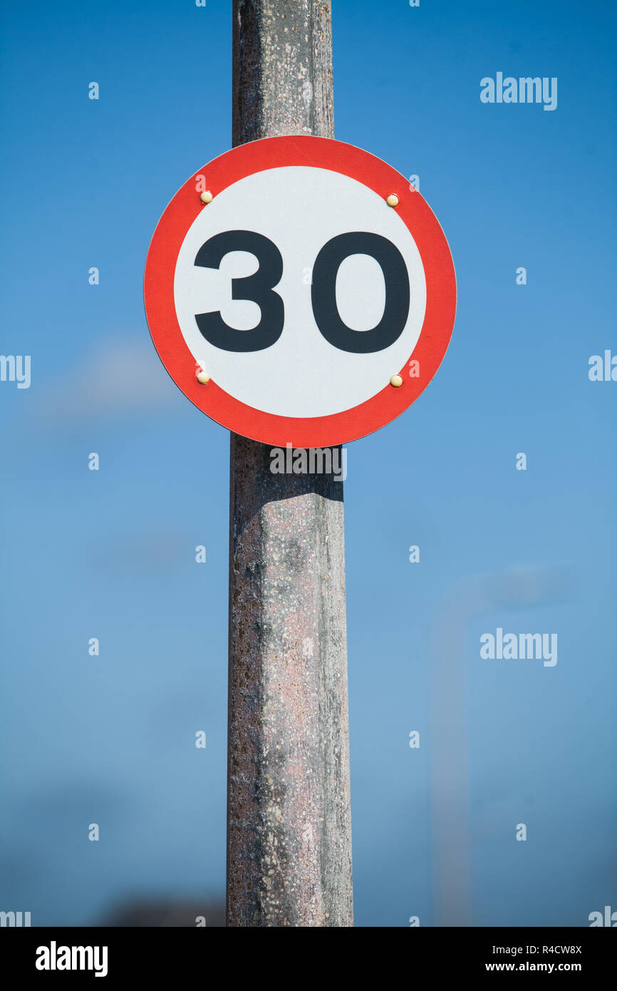 Speed restriction road sign Stock Photo - Alamy