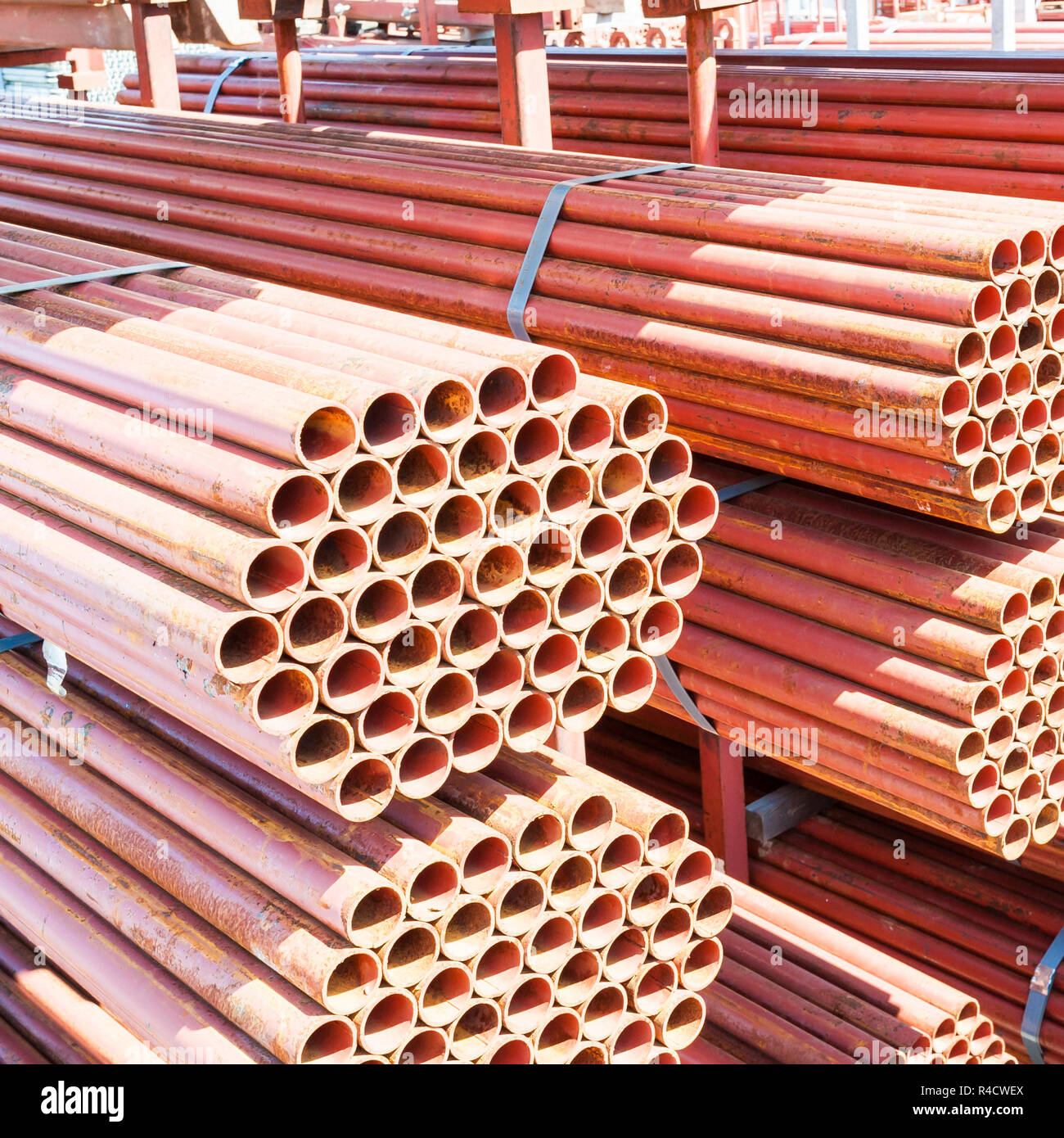 Stack of steel pipes for scaffolding in stock Stock Photo - Alamy