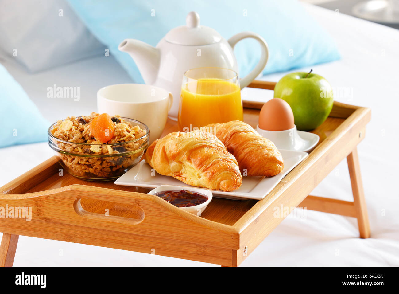 Breakfast on tray in bed in hotel room Stock Photo - Alamy