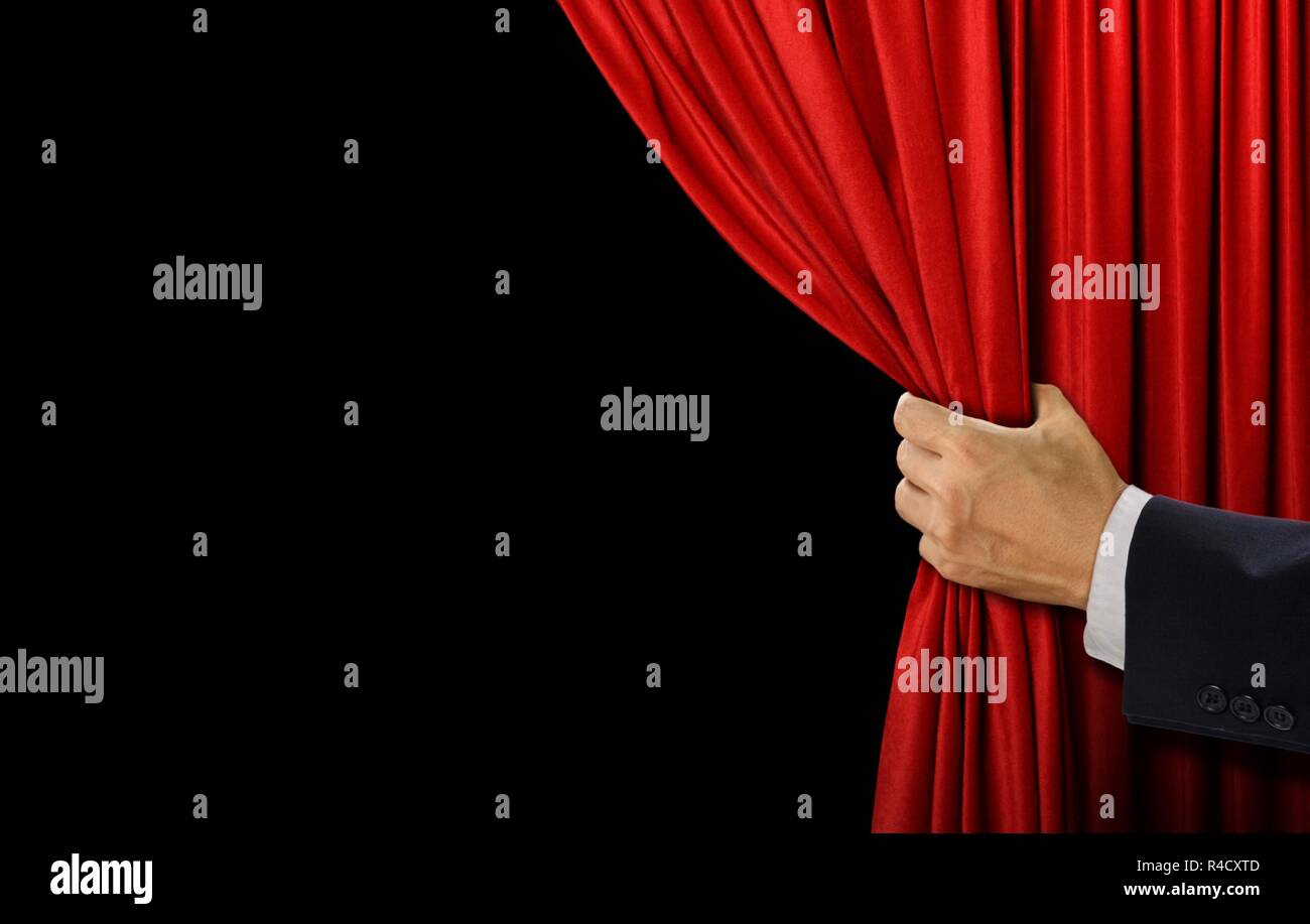 Hand open stage red curtain on black background Stock Photo - Alamy