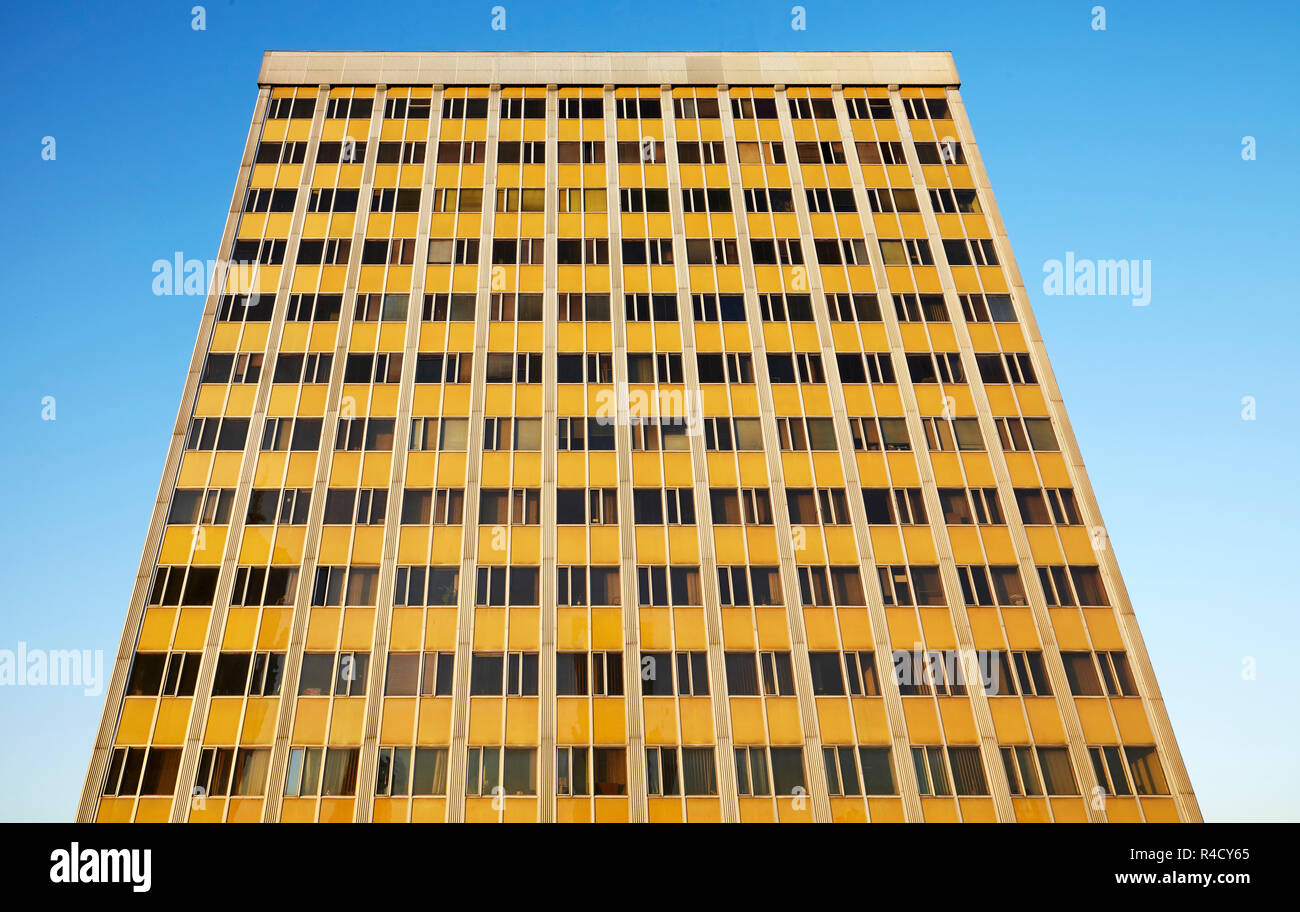 Old style skyscraper on blue sky Stock Photo - Alamy