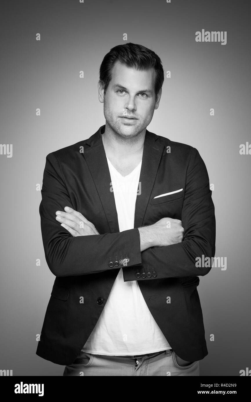 Smart man standing Black and White Stock Photos & Images - Alamy