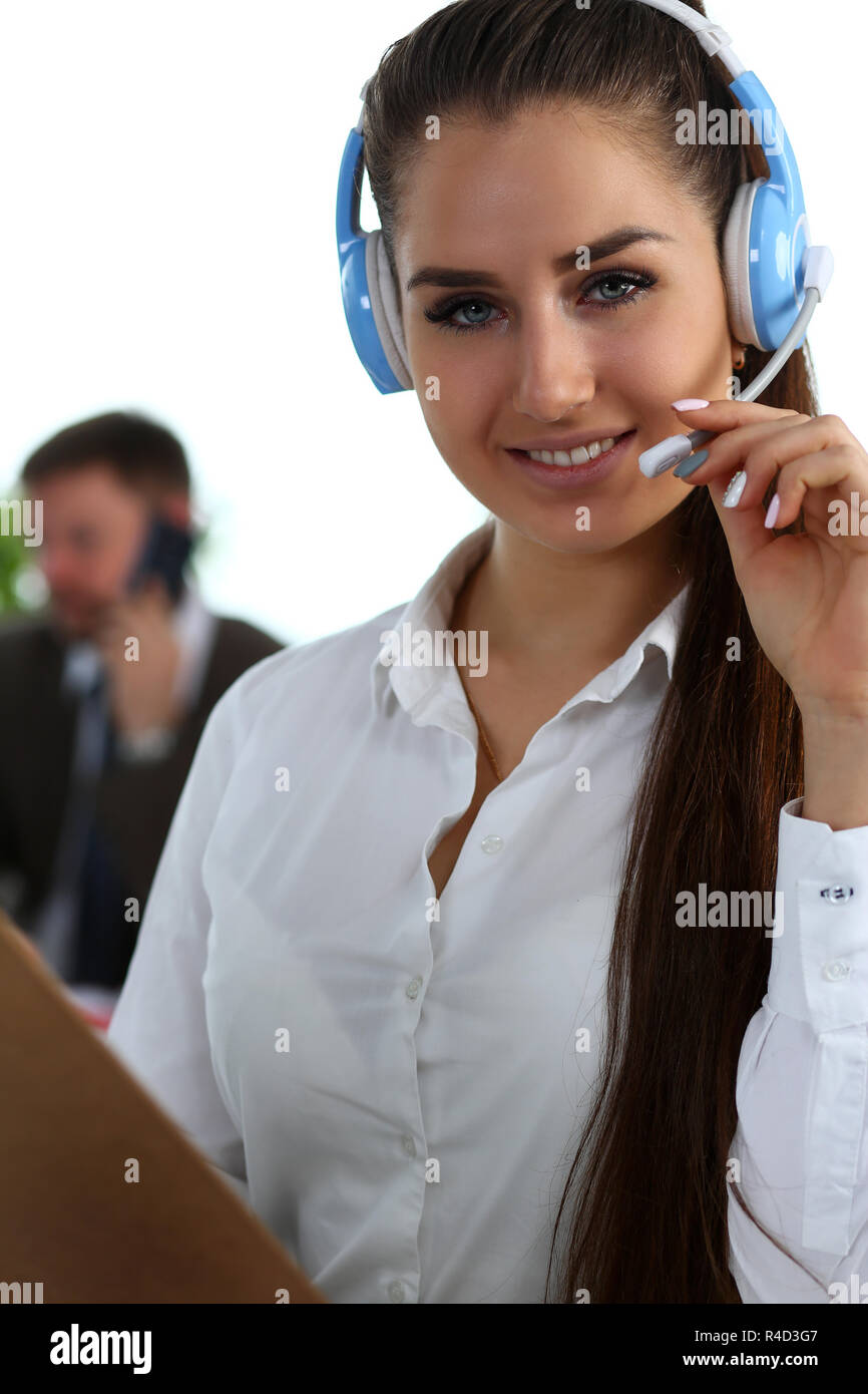 Beautiful brunette smiling call centre clerk at work Stock Photo - Alamy