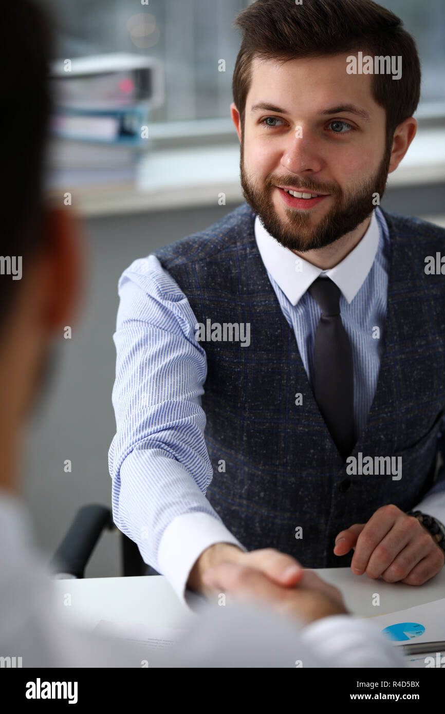 Man in suit and tie give hand as hello in office Stock Photo - Alamy