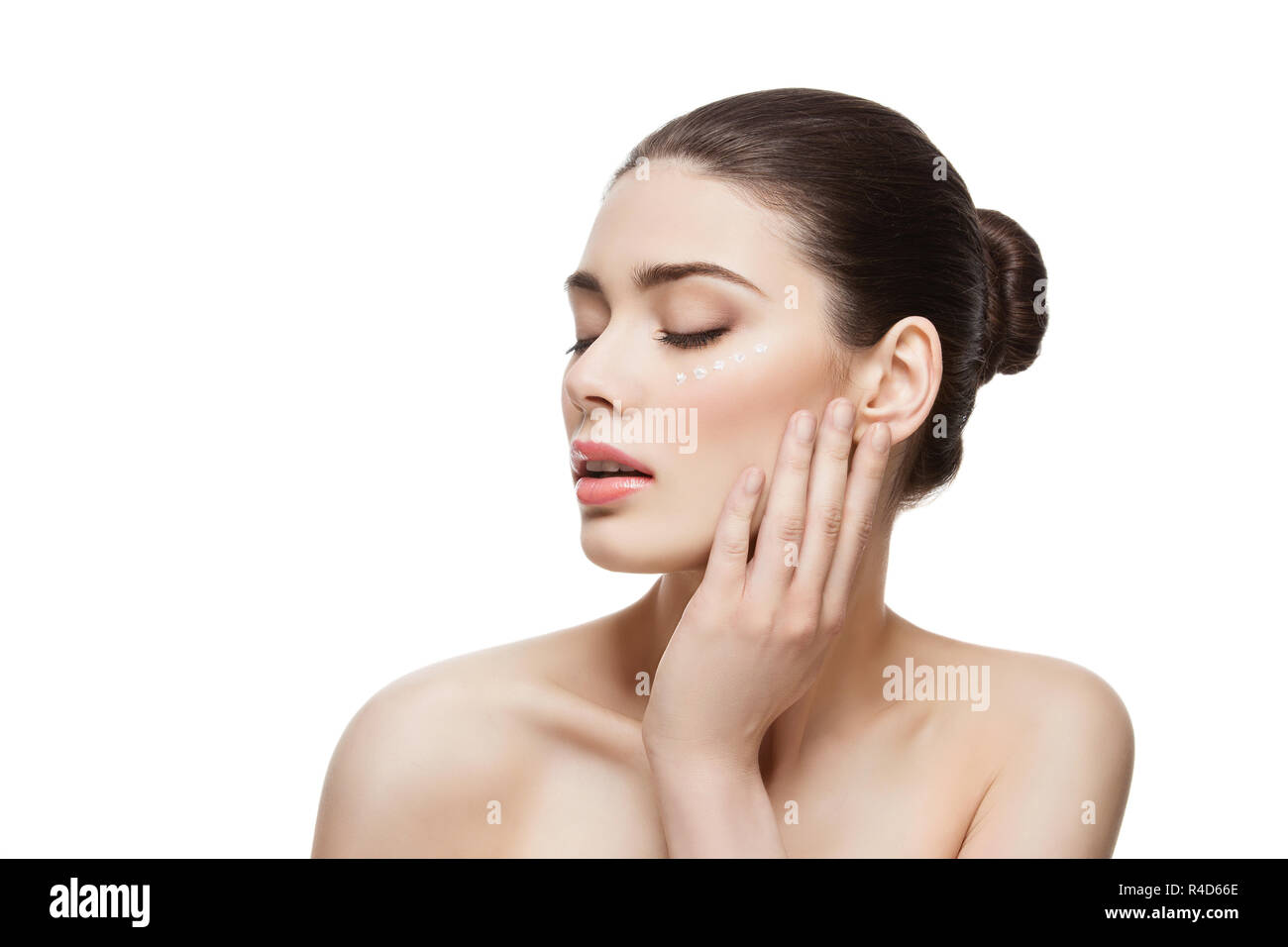 Girl with cream dots on face Stock Photo - Alamy
