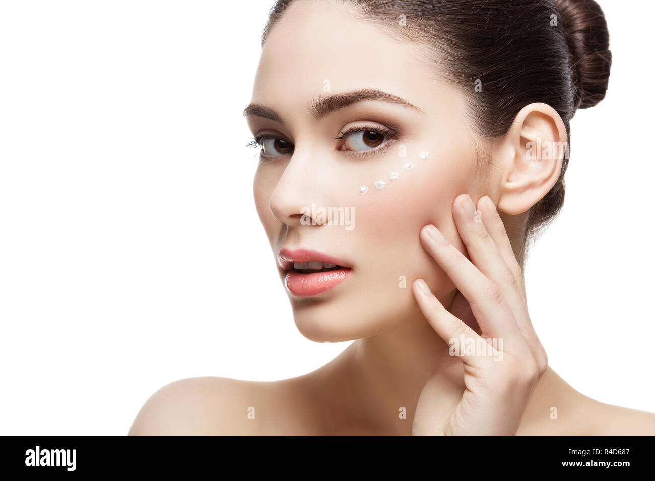 Girl with cream dots on face Stock Photo - Alamy