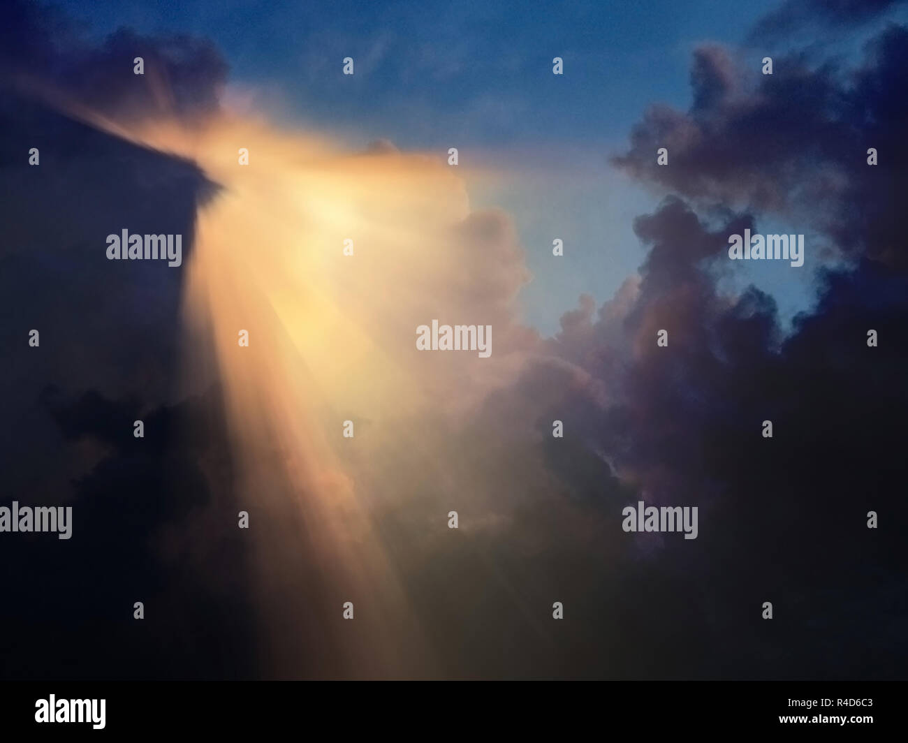 Sunshine through the clouds Stock Photo - Alamy