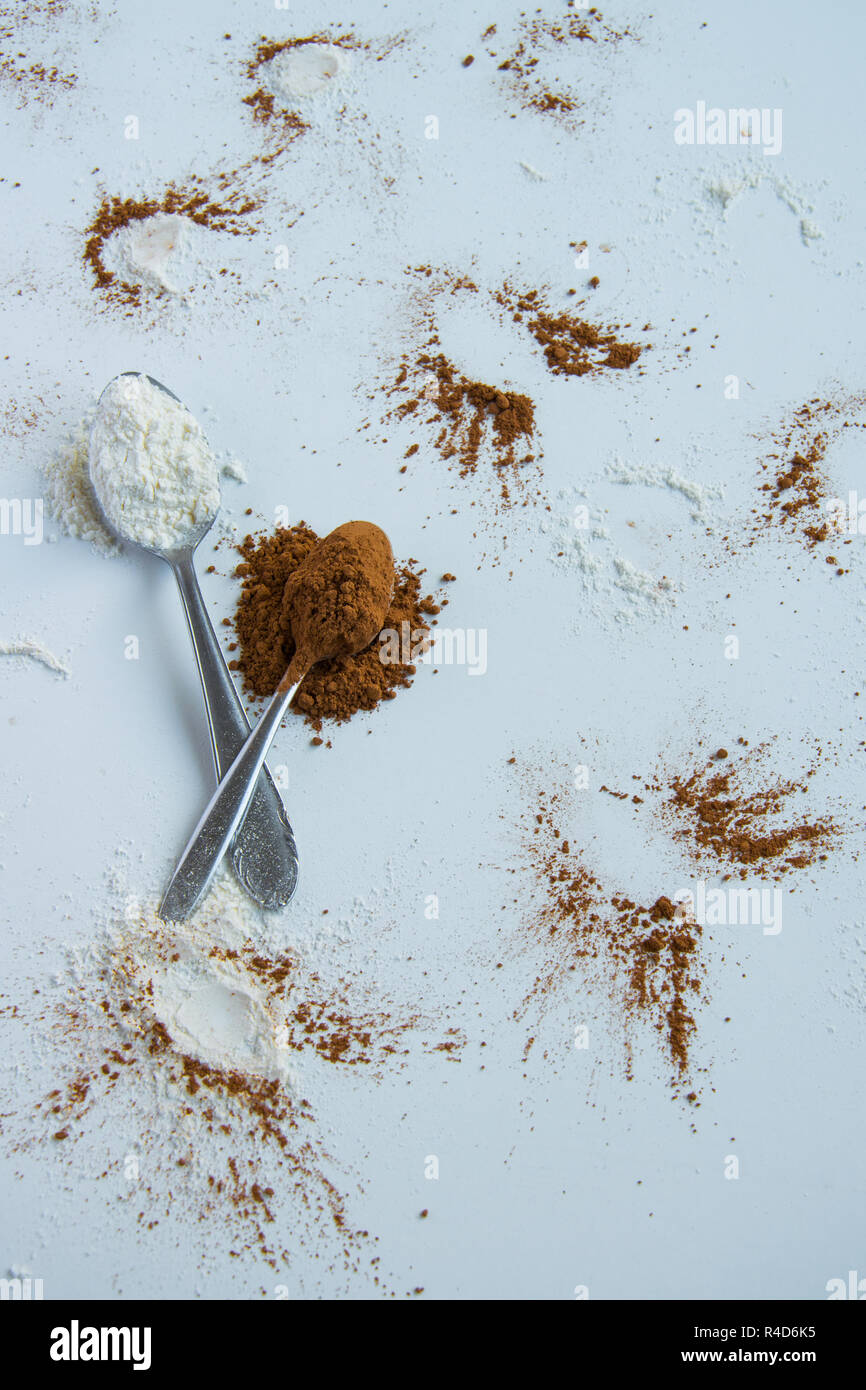 Pastry background (two spoons with cocoa and flour) with space for text ...