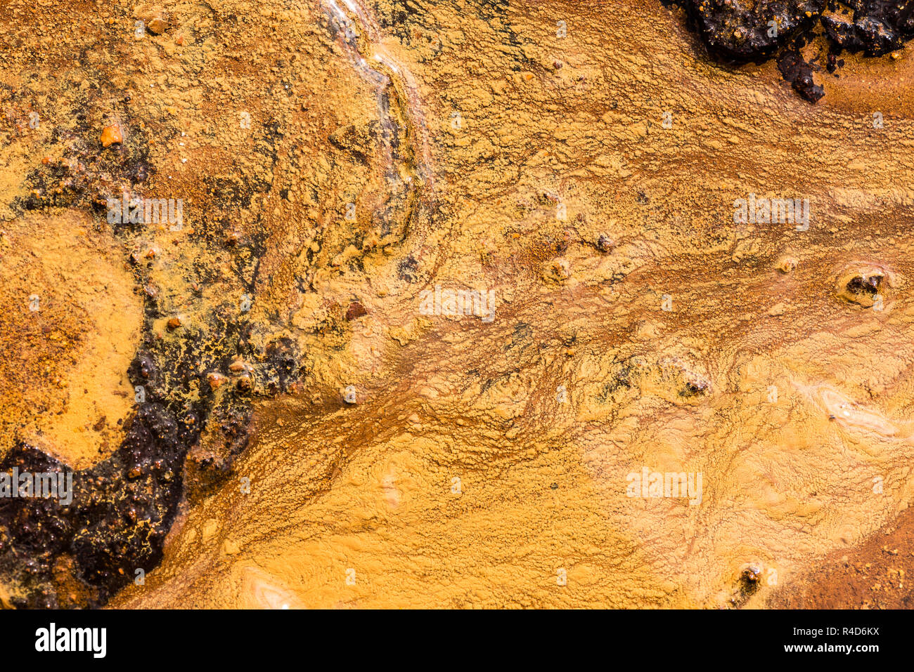 Flowing wet mud texture Stock Photo - Alamy