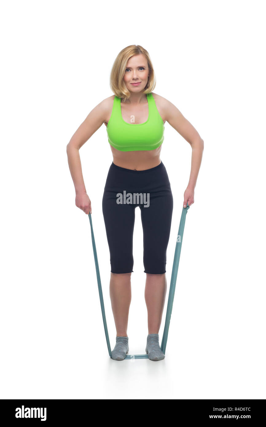 Beautiful woman doing sport exercise with rubber Stock Photo - Alamy