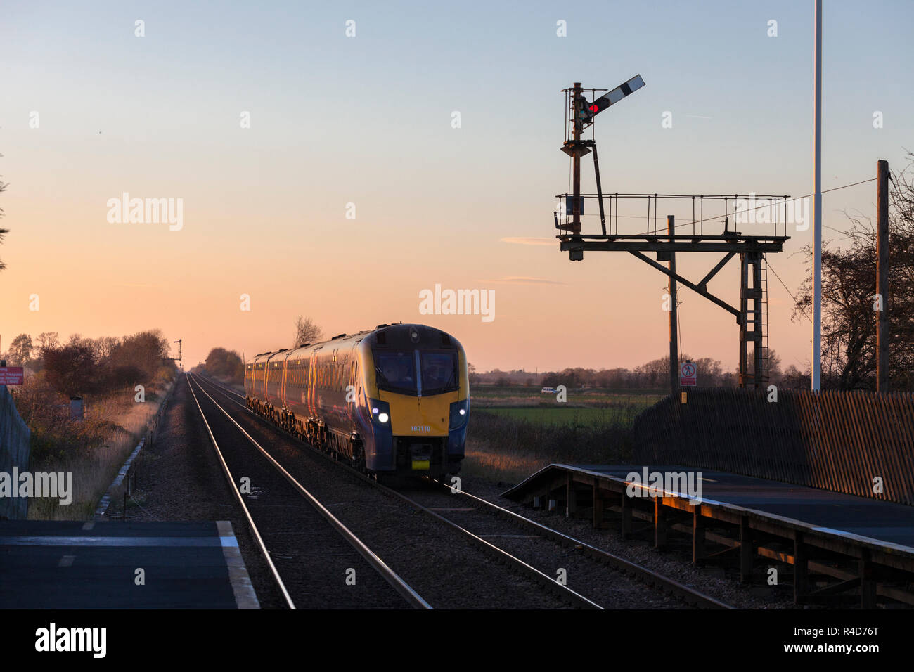 First Hull Trains class 180 DMU passing the bracket semaphore signal at ...