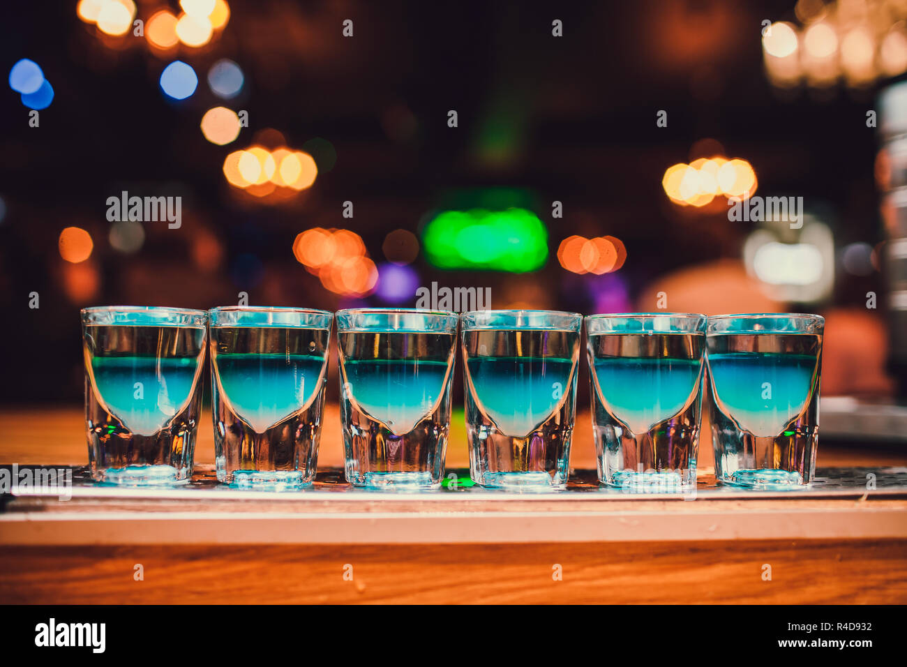 Cocktails at the club. Blue cocktails in the club. Set of cocktails on ...