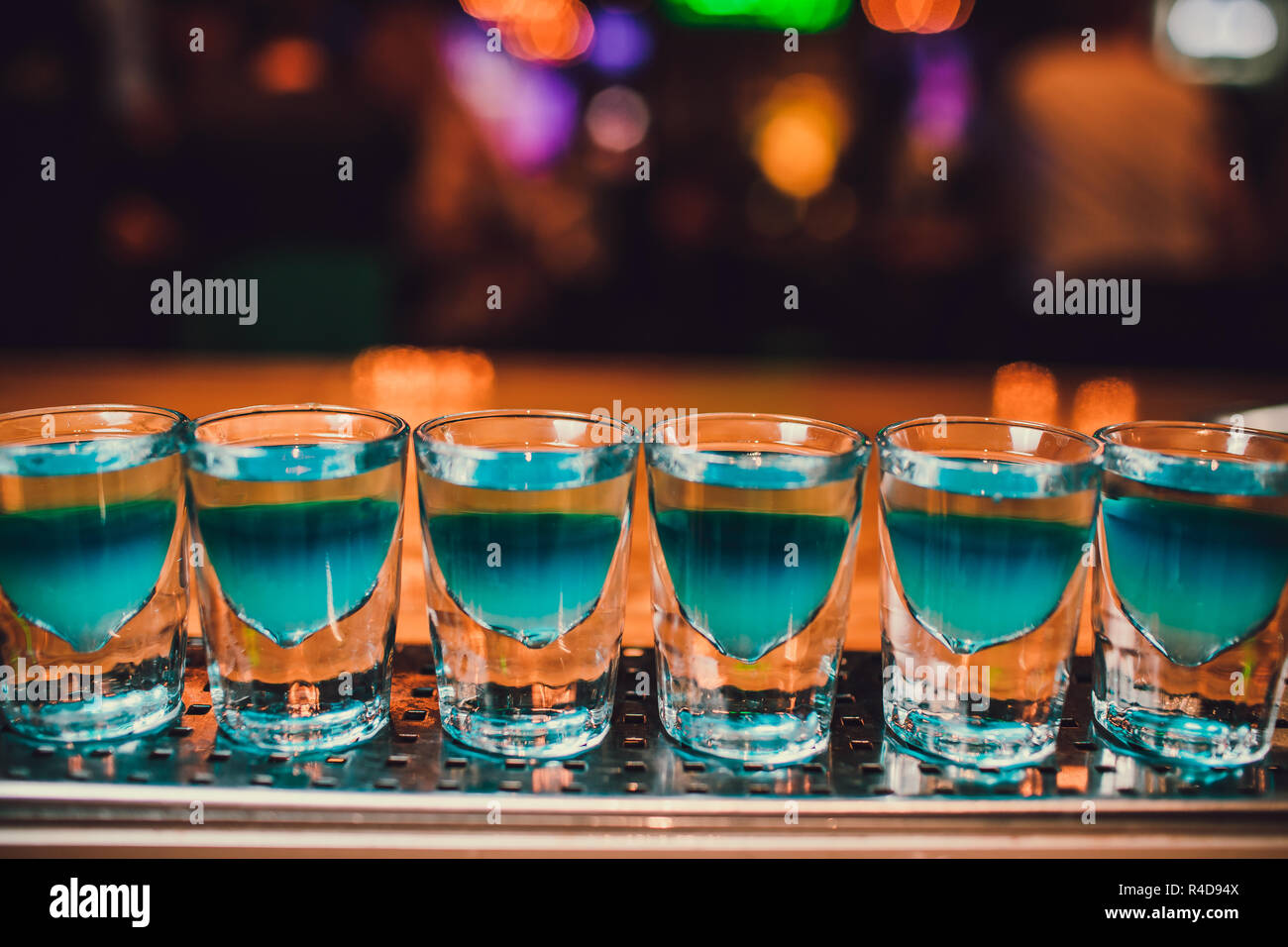 Cocktails at the club. Blue cocktails in the club. Set of cocktails on ...
