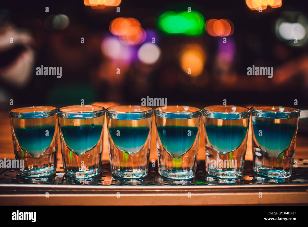 Cocktails at the club. Blue cocktails in the club. Set of cocktails on ...