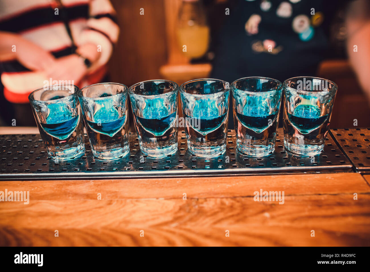 Cocktails at the club. Blue cocktails in the club. Set of cocktails on ...