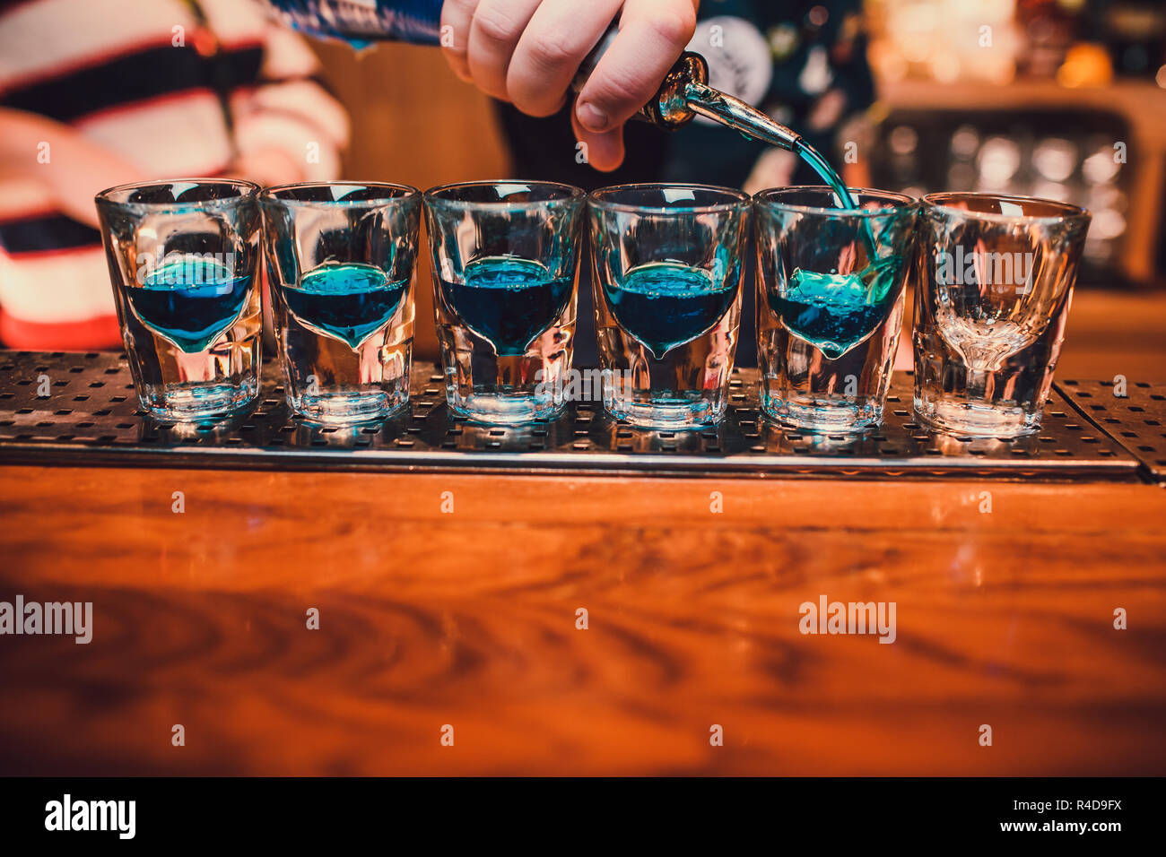 Cocktails at the club. Blue cocktails in the club. Set of cocktails on ...