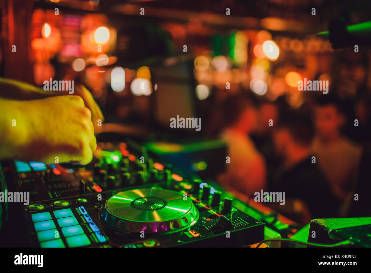 DJ remote, turntables, and hands . Night life at the club, party Stock ...