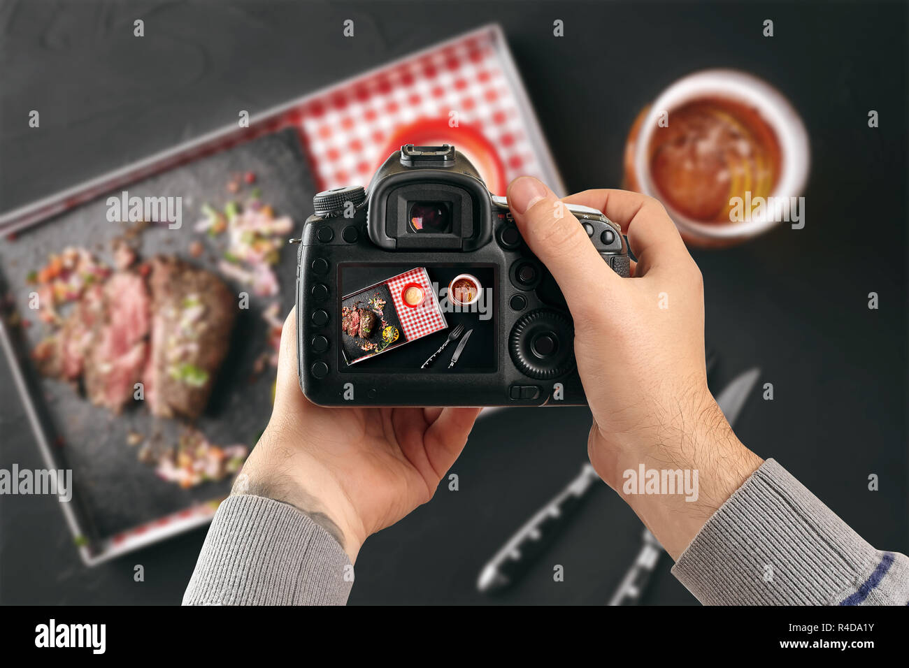 Digital single-lens reflex camera in hands. Man photographer makes ...