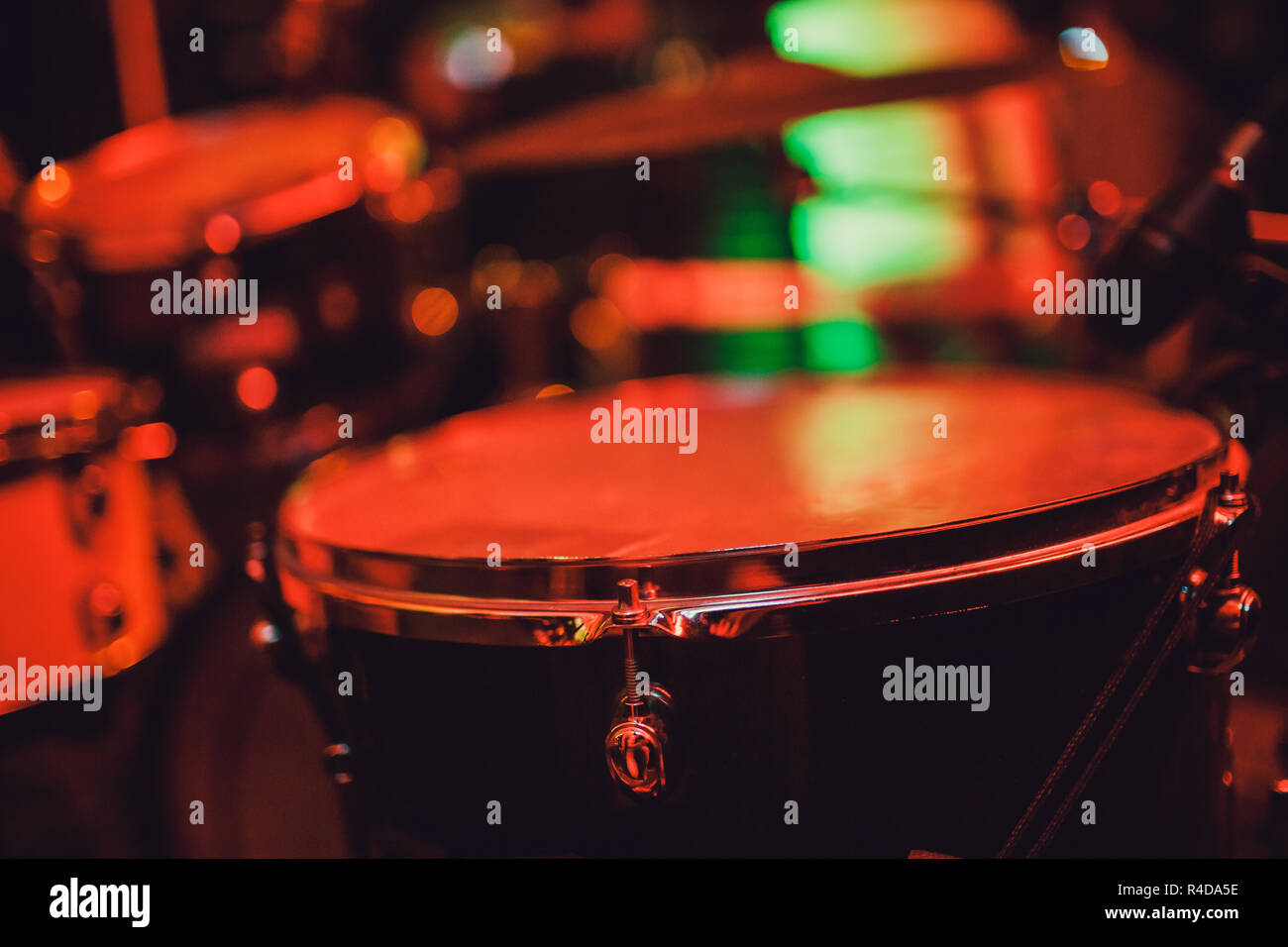 Drum kit on stage in the spotlight color Stock Photo - Alamy
