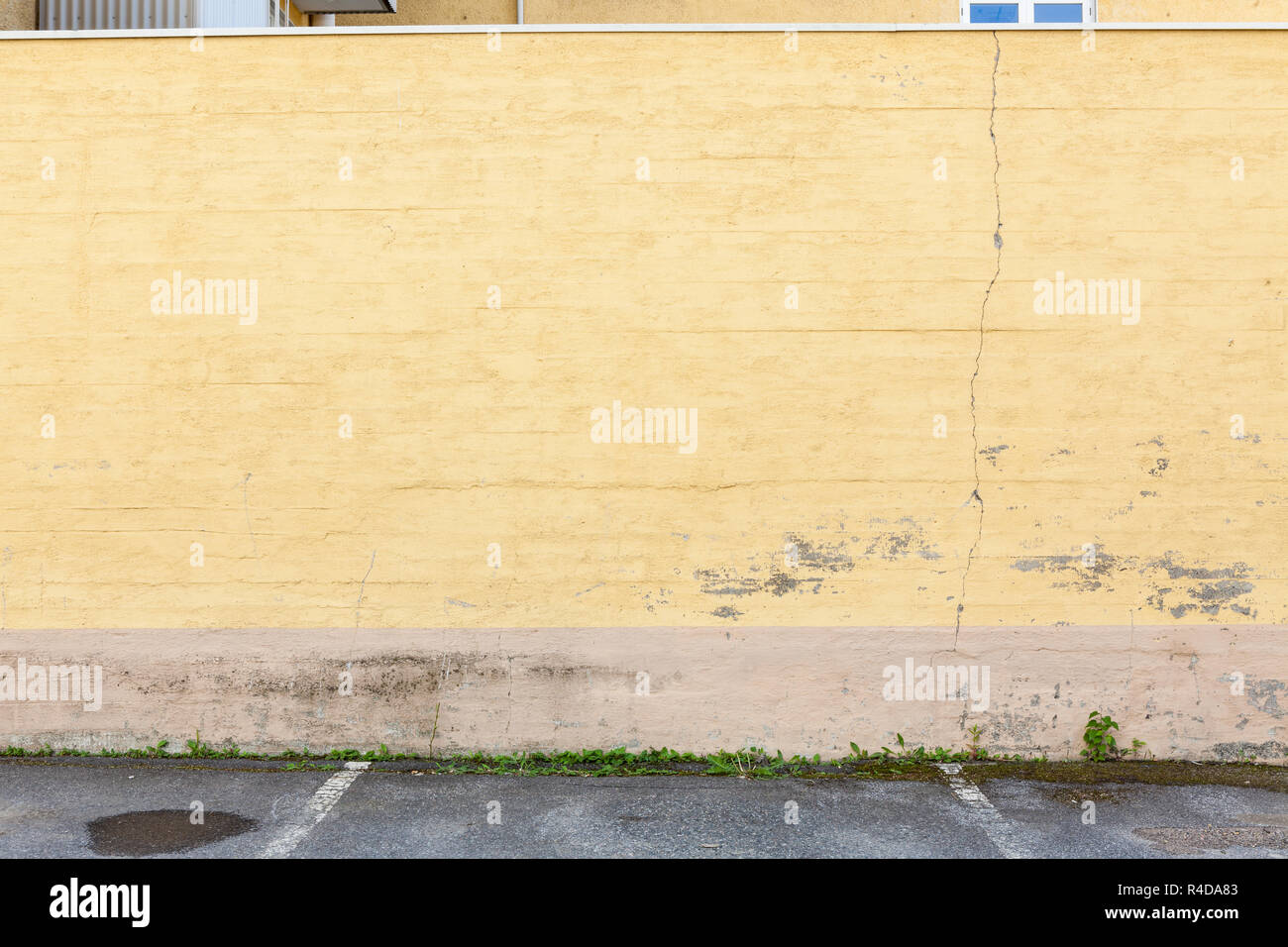 Old worn yellow concrete wall outdoors Stock Photo - Alamy