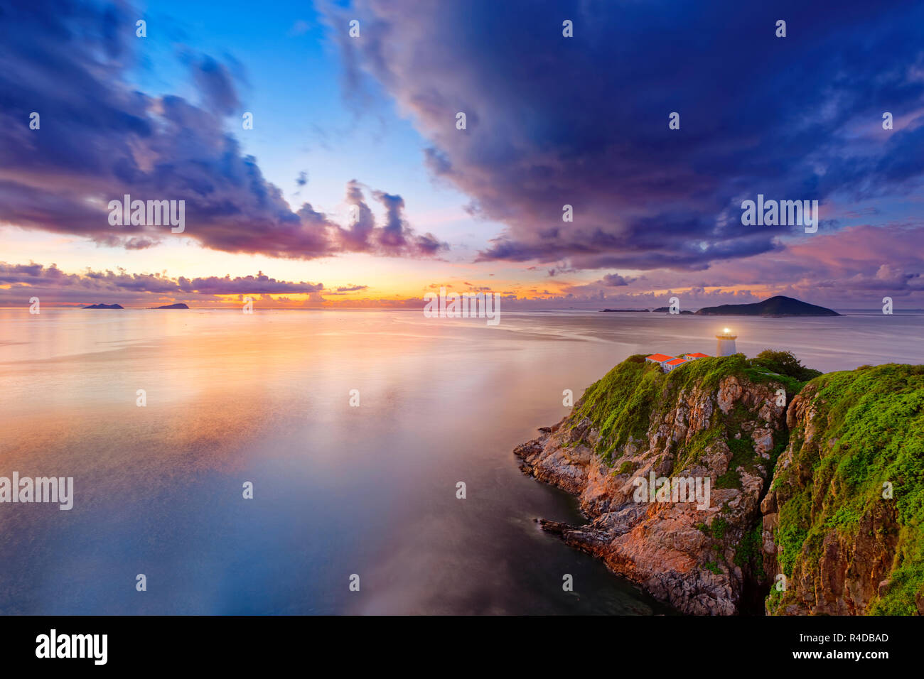 Hong Kong lighthouse during sunrise Stock Photo - Alamy