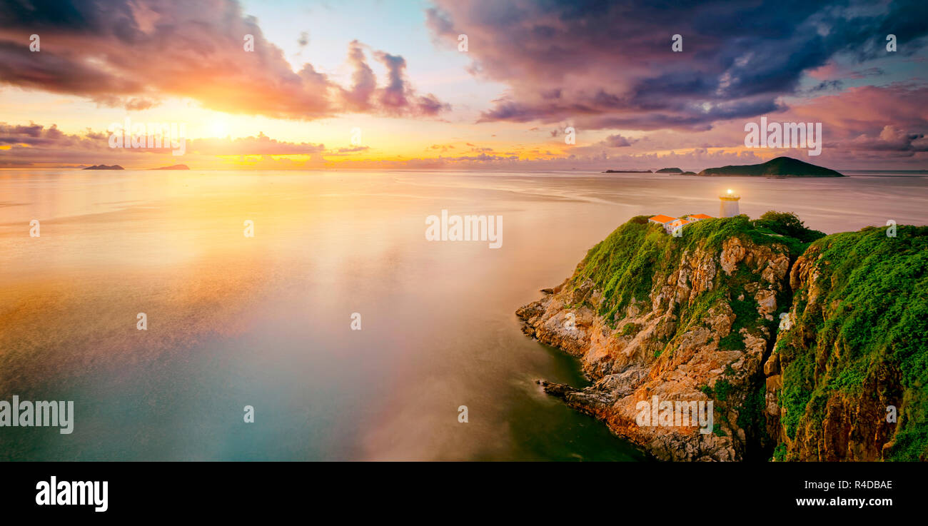 Hong Kong lighthouse during sunrise Stock Photo - Alamy