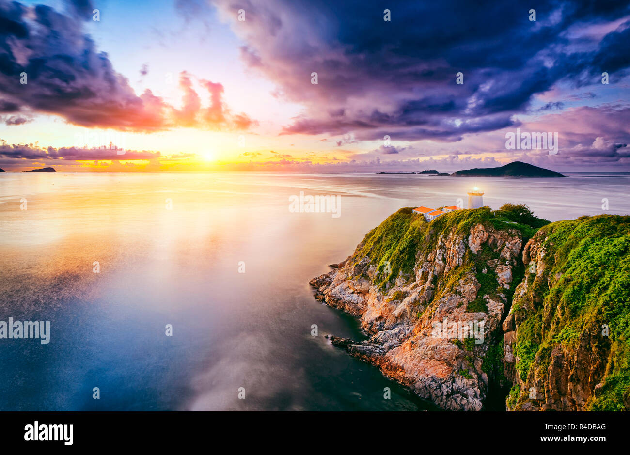 Hong Kong lighthouse during sunrise Stock Photo - Alamy