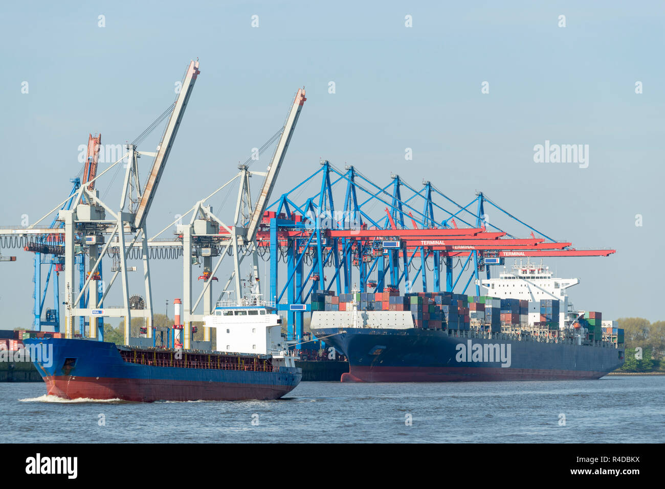 container ship at a container terminal on the elbe in hamburg,germany ...