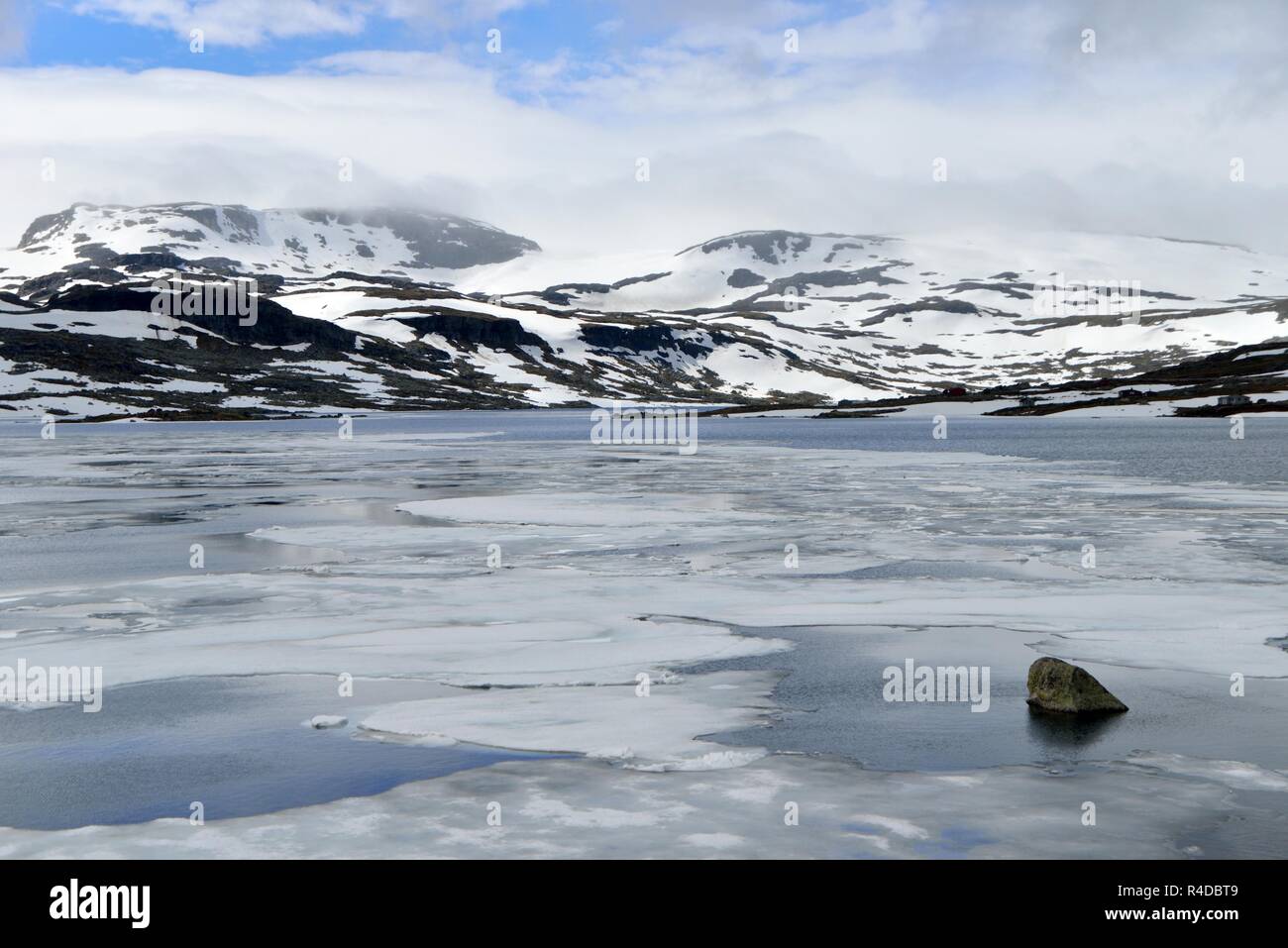 Lake with ice in Norweigian highlands Stock Photo - Alamy