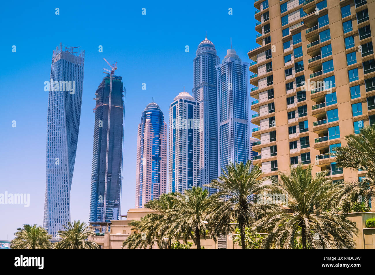 Dubai skyline with skyscrapers on a sunny day. Construction concept ...