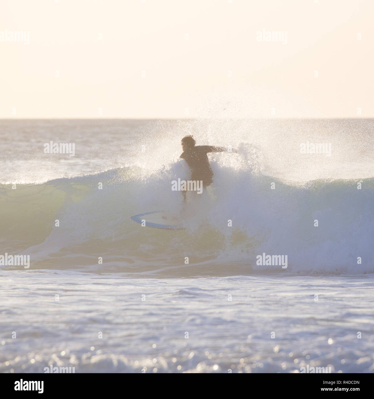 Surfer riding a big wave Stock Photo - Alamy