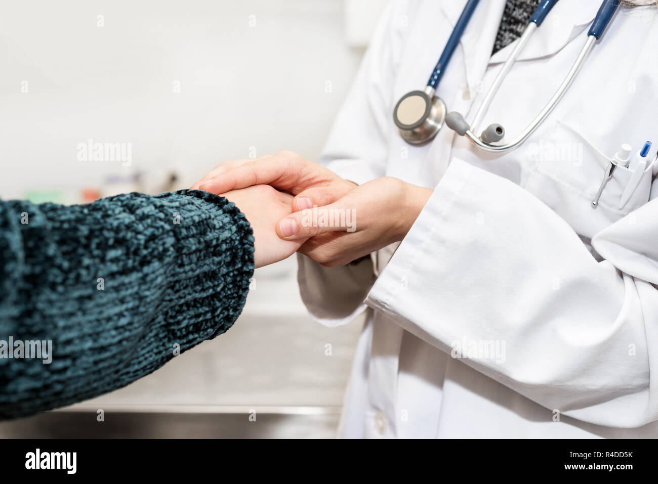 Doctor holding patient's hands, helping and empathy concept Stock Photo ...