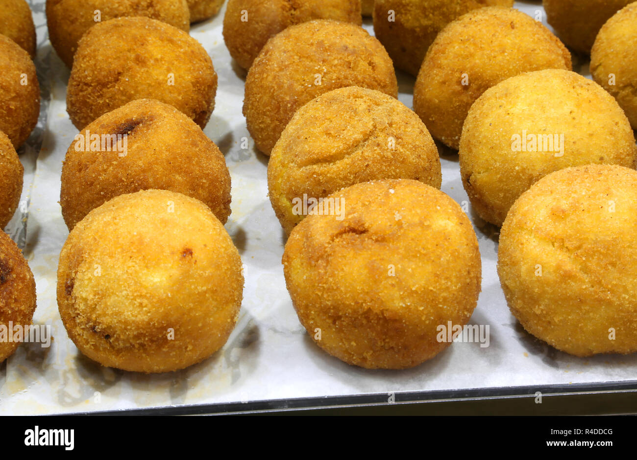 balls of rice are the typical specialty of southern Italy. The balls of ...