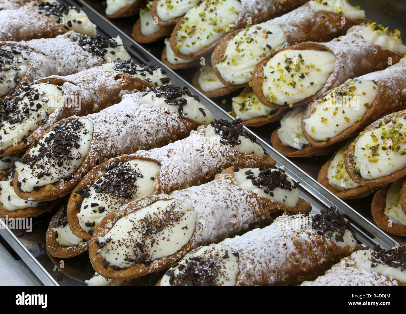 typical Sicilian cannoli stuffed with ricotta and chocolate and ...